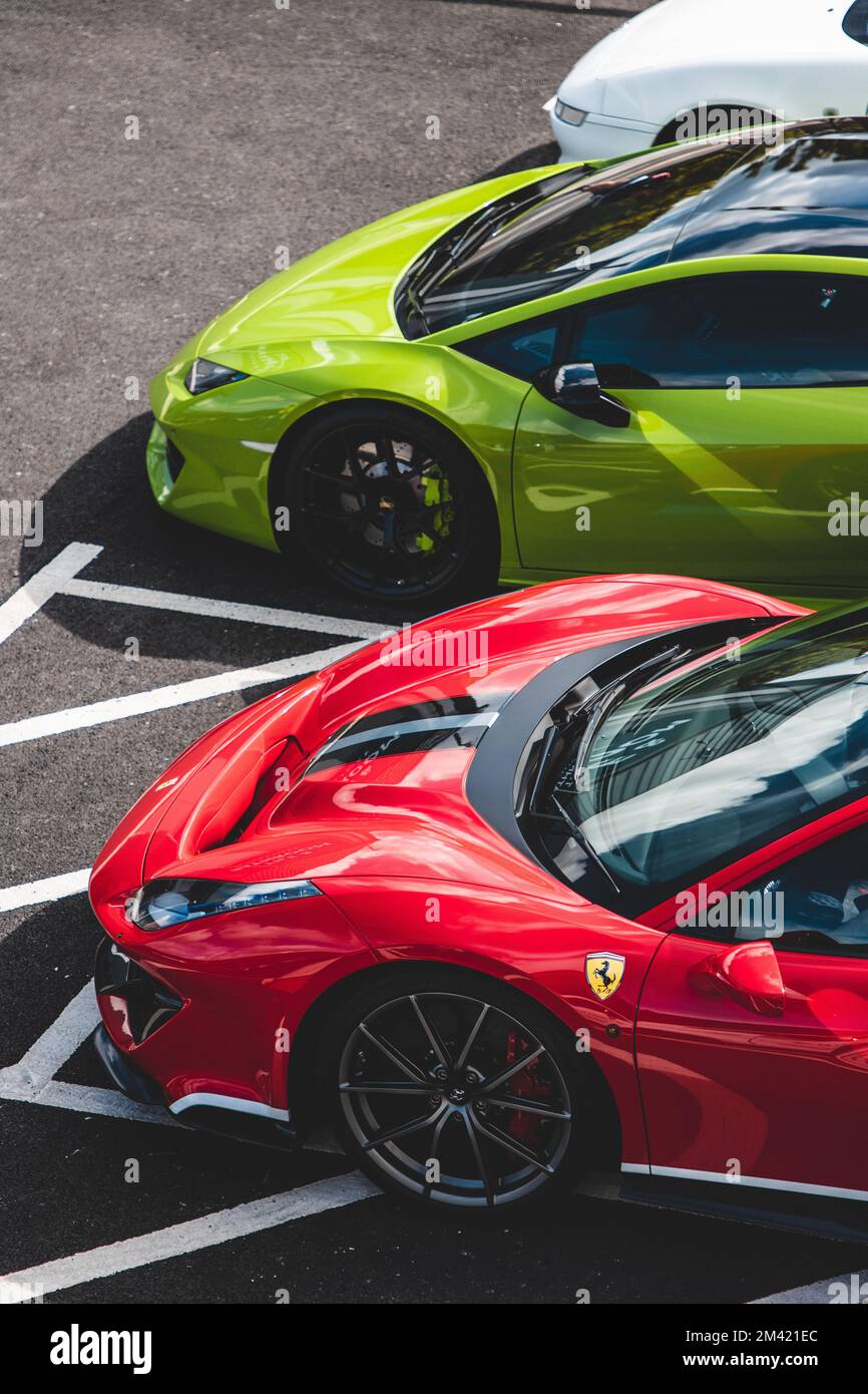 A red Ferrari at a car meet in Derbyshire displayed alongside a ...