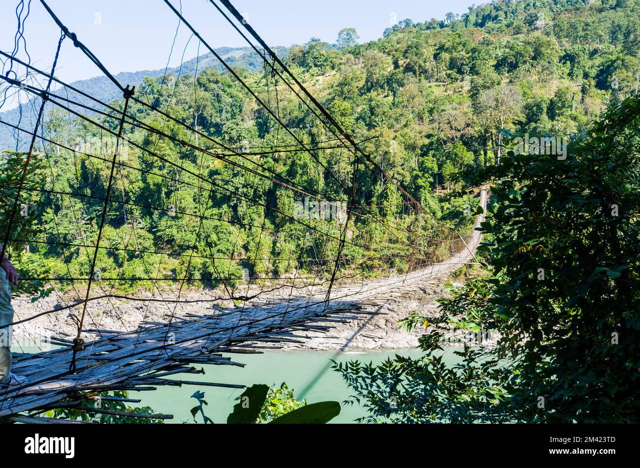 A 300 m long hanging bridge crosses the mighty river Siang in the hills ...
