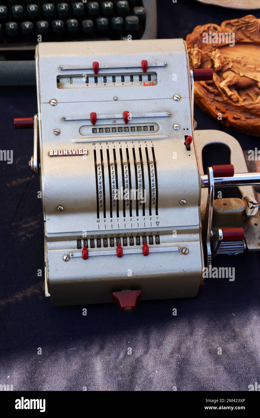 Ancient calculator machine on table for exhibition Stock Photo - Alamy