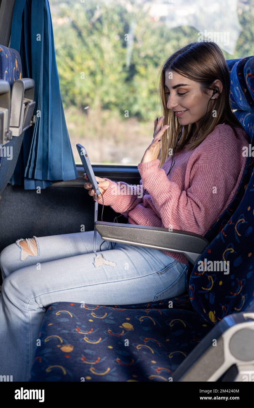 Beautiful young woman enjoying the travel on bus or train - wanderlust ...