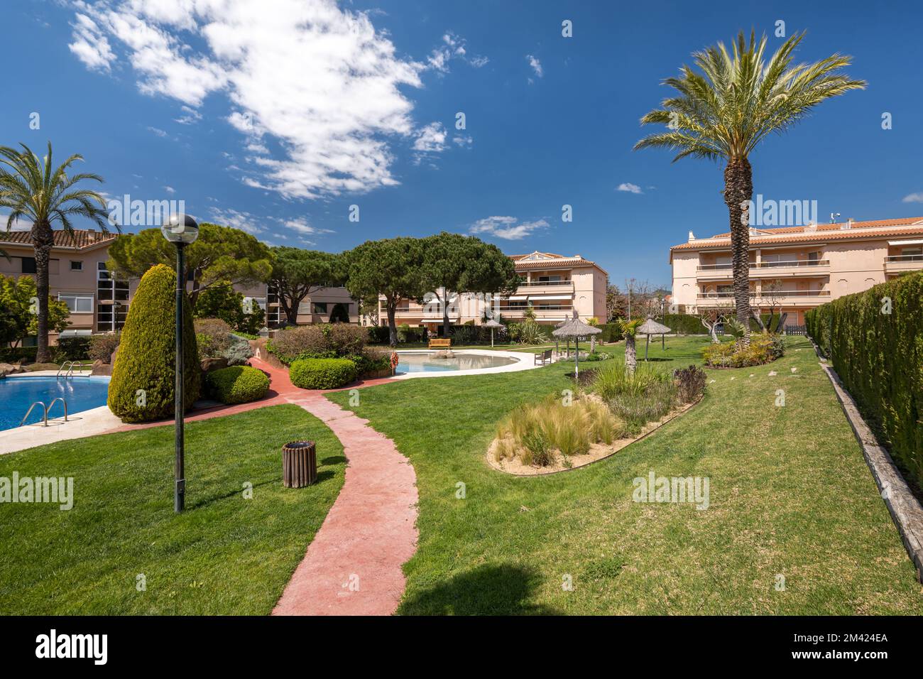 Well-groomed cozy mini park inside residential hotel complex with green ...