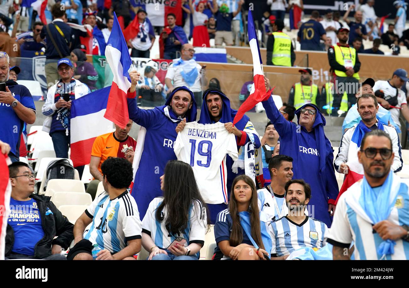 France fans pose for photographs with Argentina fans around them before ...