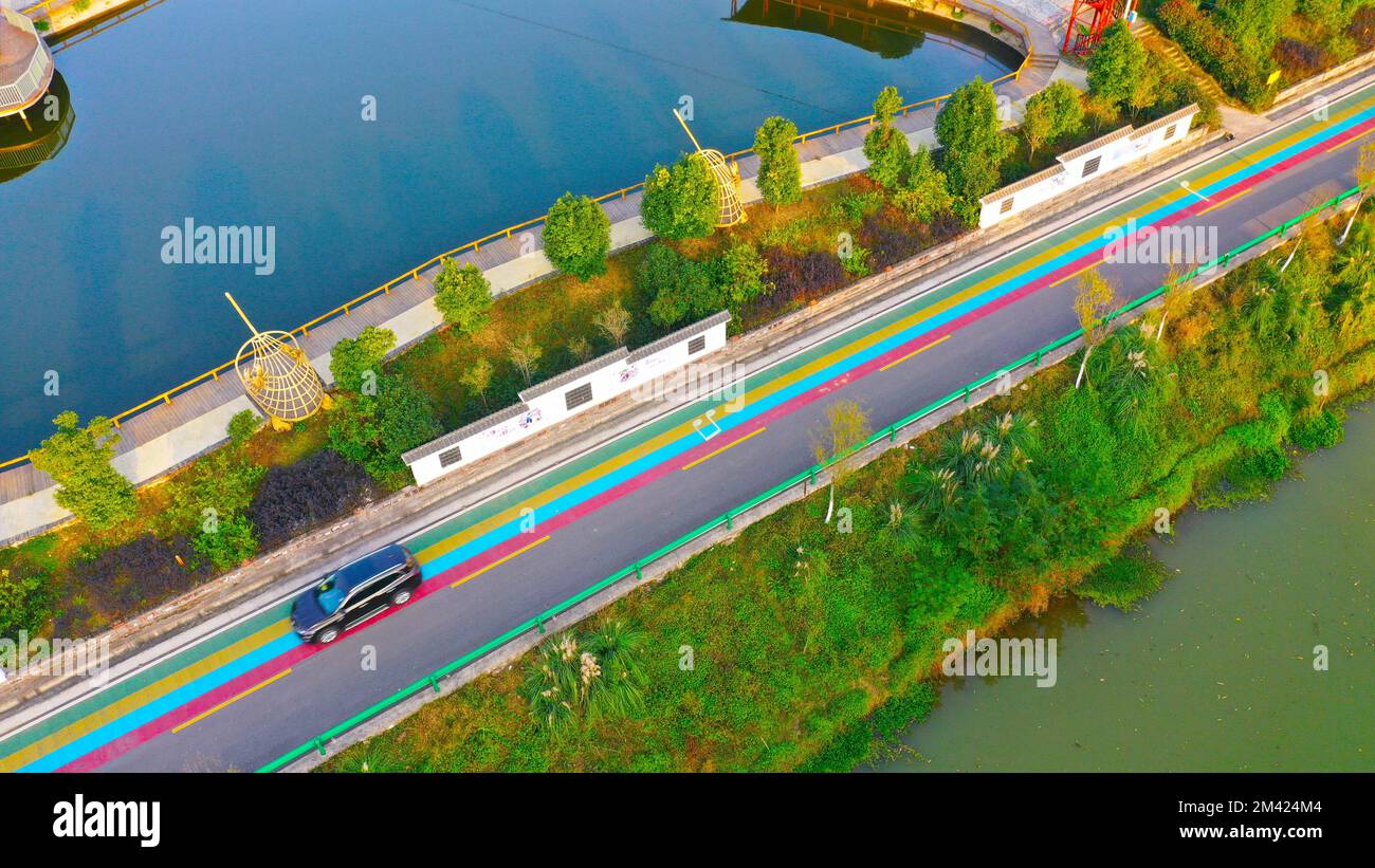 CHONGQING, CHINA - DECEMBER 18, 2022 - Vehicles drive on the colorful ...