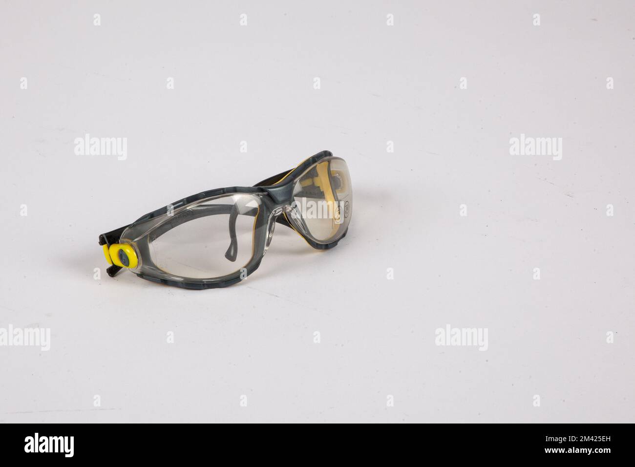 Industrial safety glasses on isolated white background Stock Photo - Alamy
