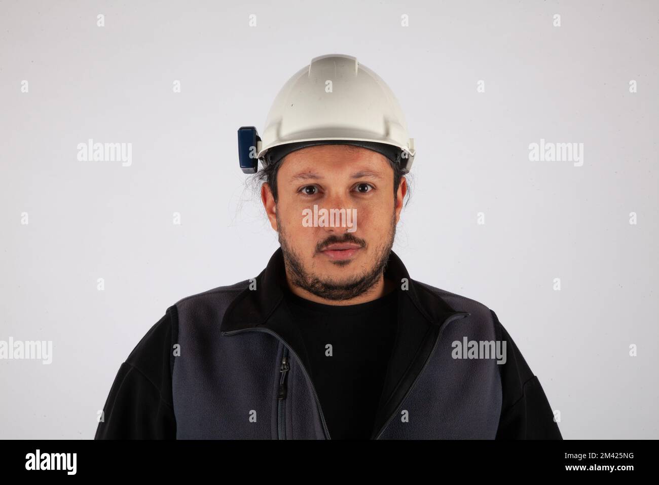 Portrait of a man with a hard cap on white isolated background Stock ...