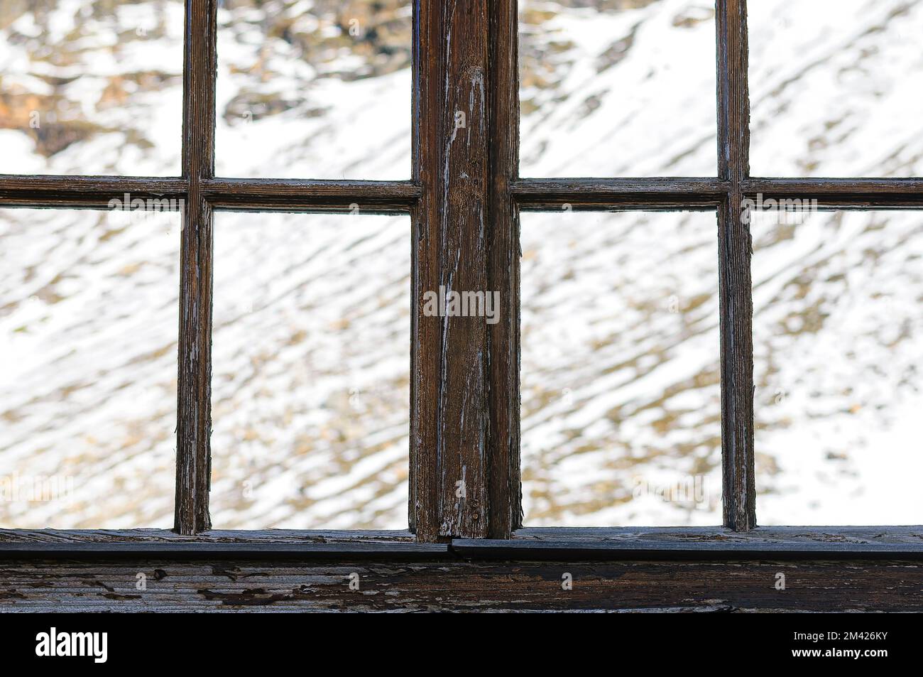 Reflection of snow covered mountain in windows Stock Photo - Alamy