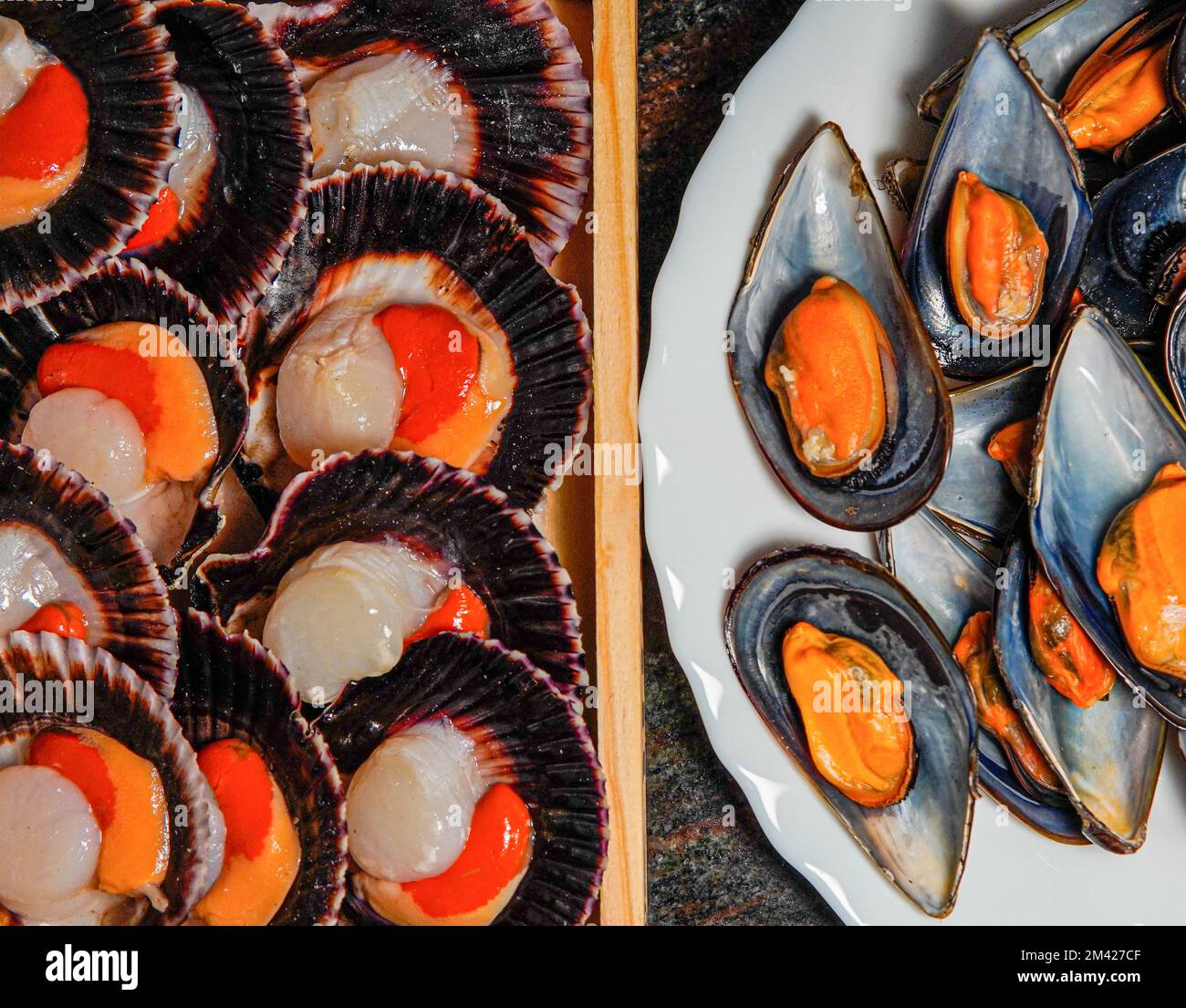 raw mussels and scallops. traditional Galician, Spanish food Stock ...
