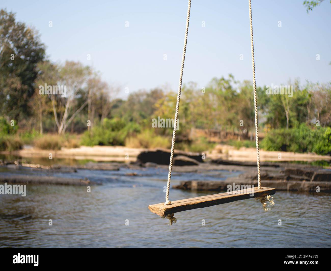 Rope swing child water hi-res stock photography and images - Alamy