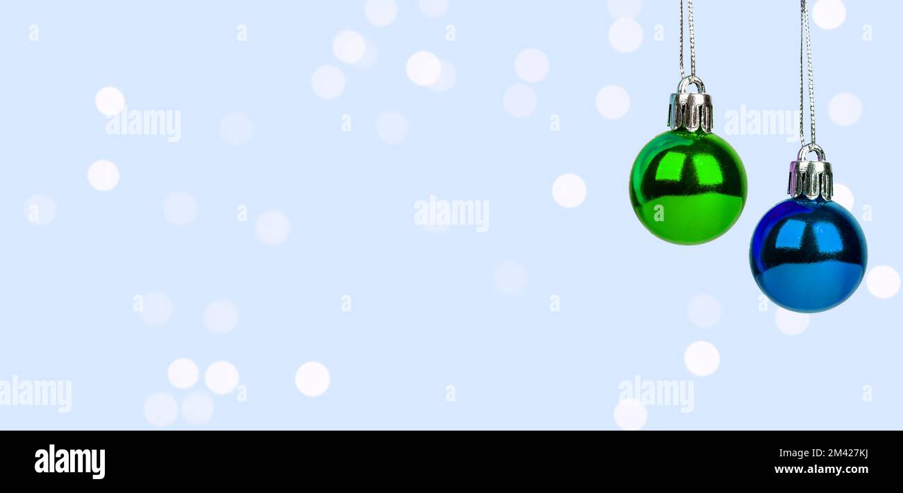 Christmas baubles, green and blue balls hanging on string, ad banner ...