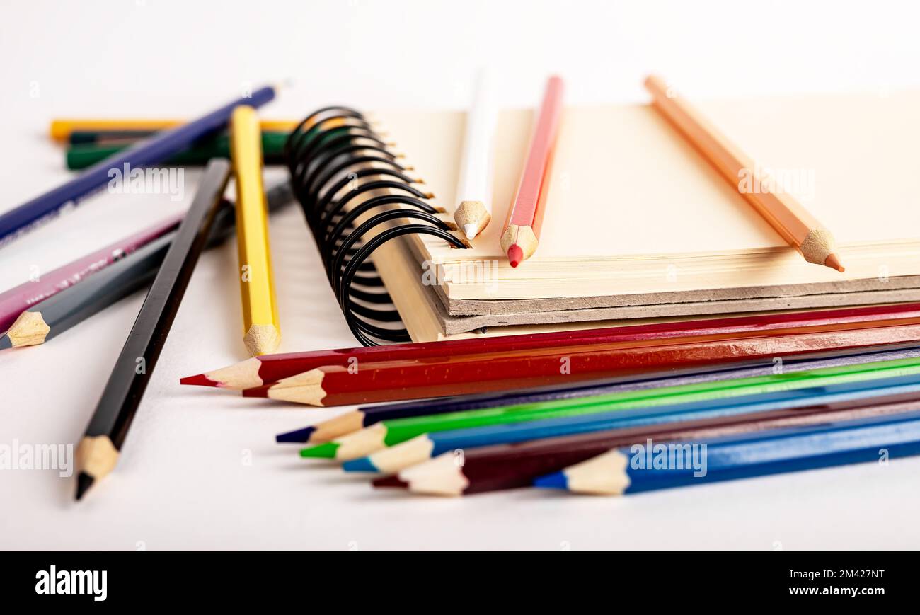 Colored pencils, notepad, sketchbook for drawing. Creative supplies ...