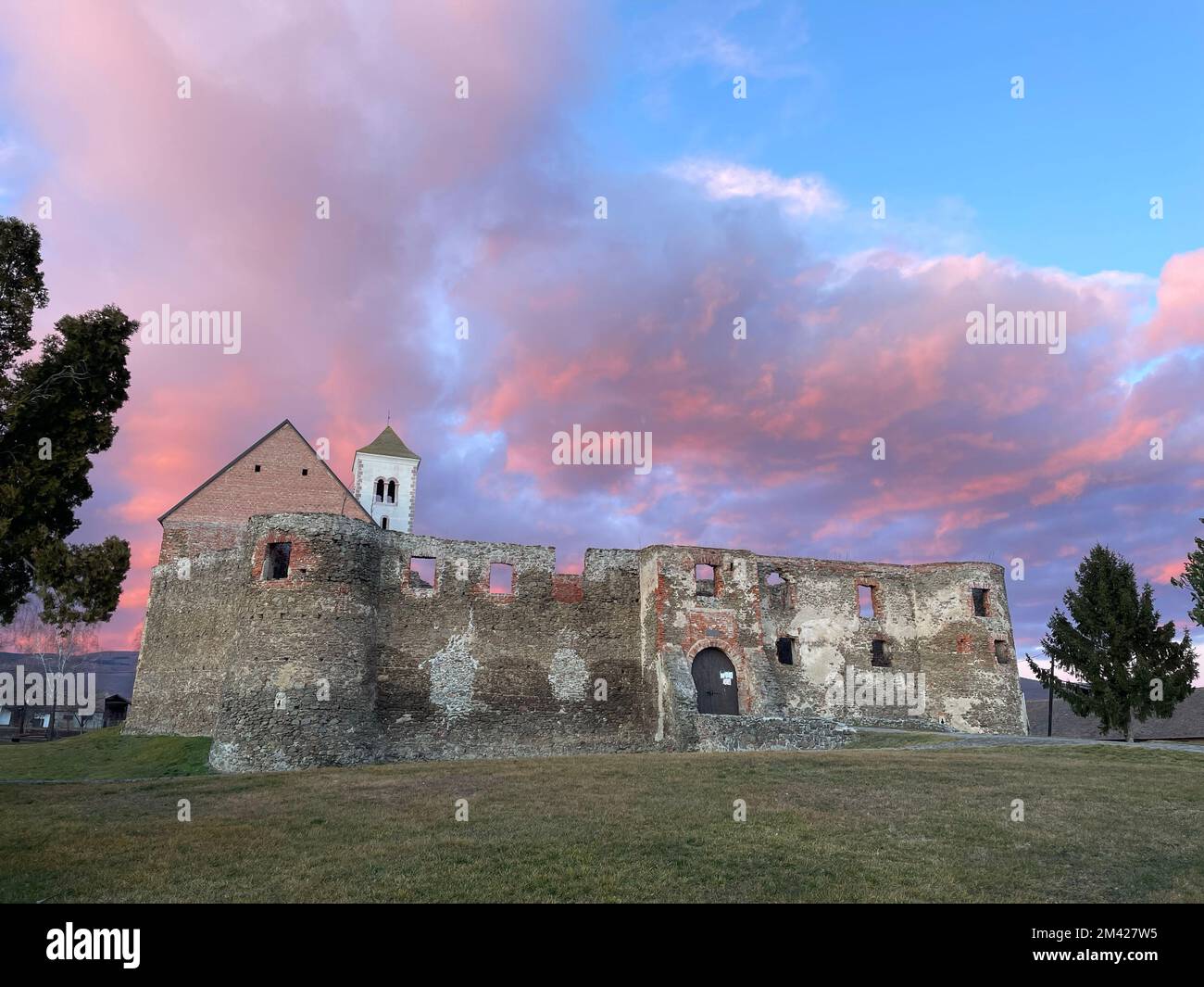 The view of Kaptol utvrda castle ruins under the shaded cloudy sunset ...