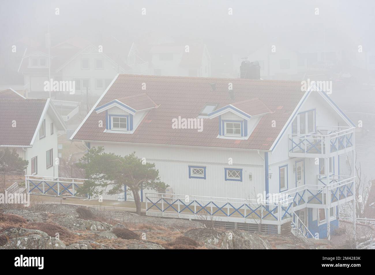 Residential houses in mist Stock Photo - Alamy