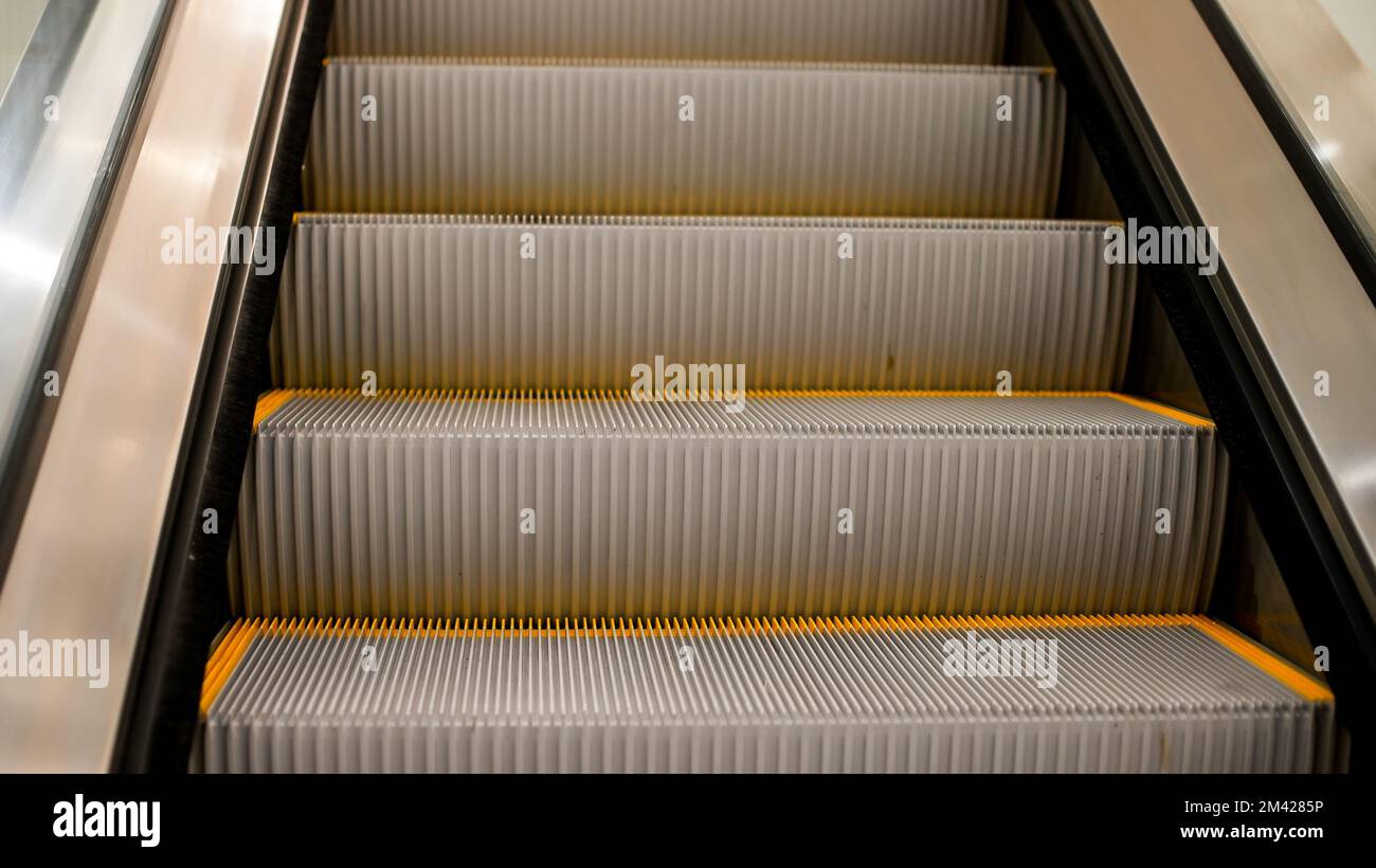 Stairs escalator close up in mall with selective focusing Stock Photo ...