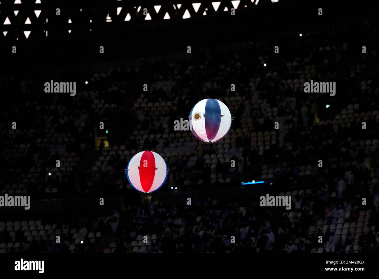 Balls with the France and Argentina flags on them float in the air ...