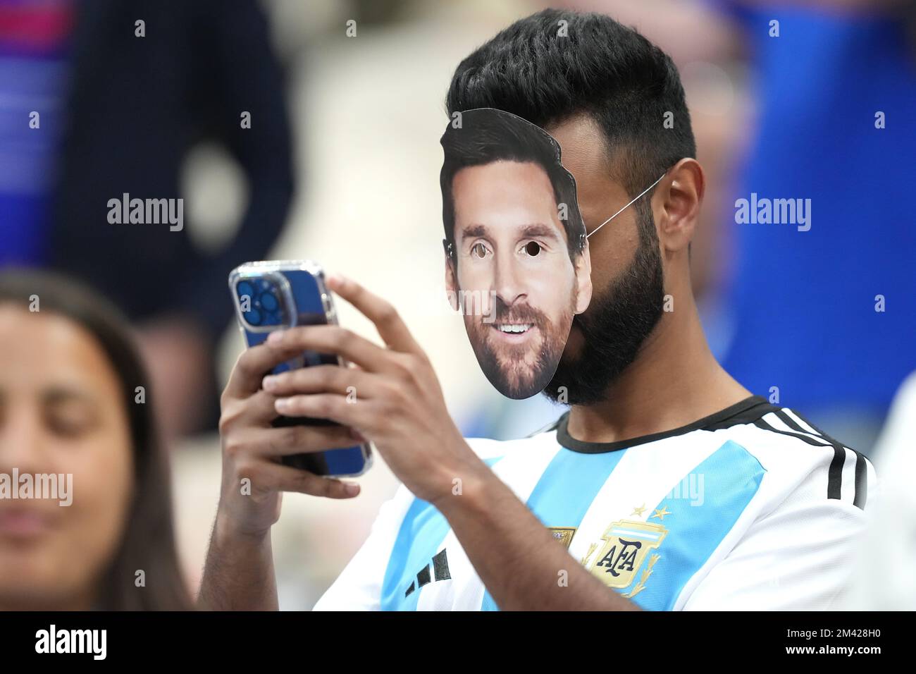 Argentina fans wearing face masks of Argentina's Lionel Messi before ...