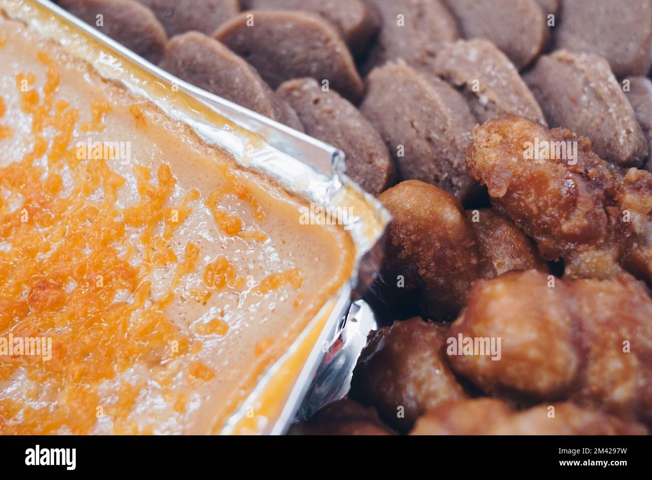 Traditional Filipino desserts AKA Kakanin namely Cassava cake in foil ...