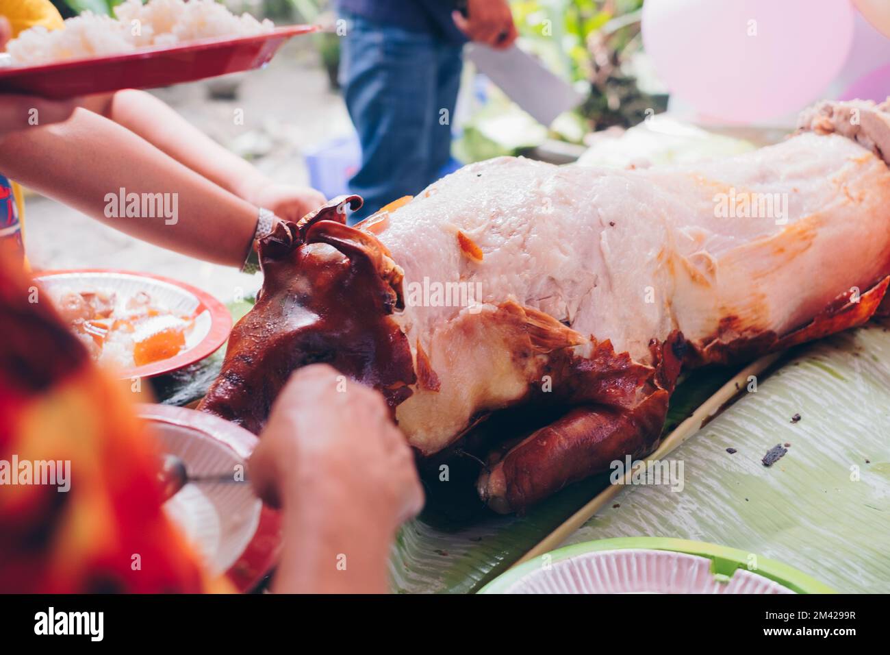 Butcher slicing into pieces the all-time favorite, the popular ...