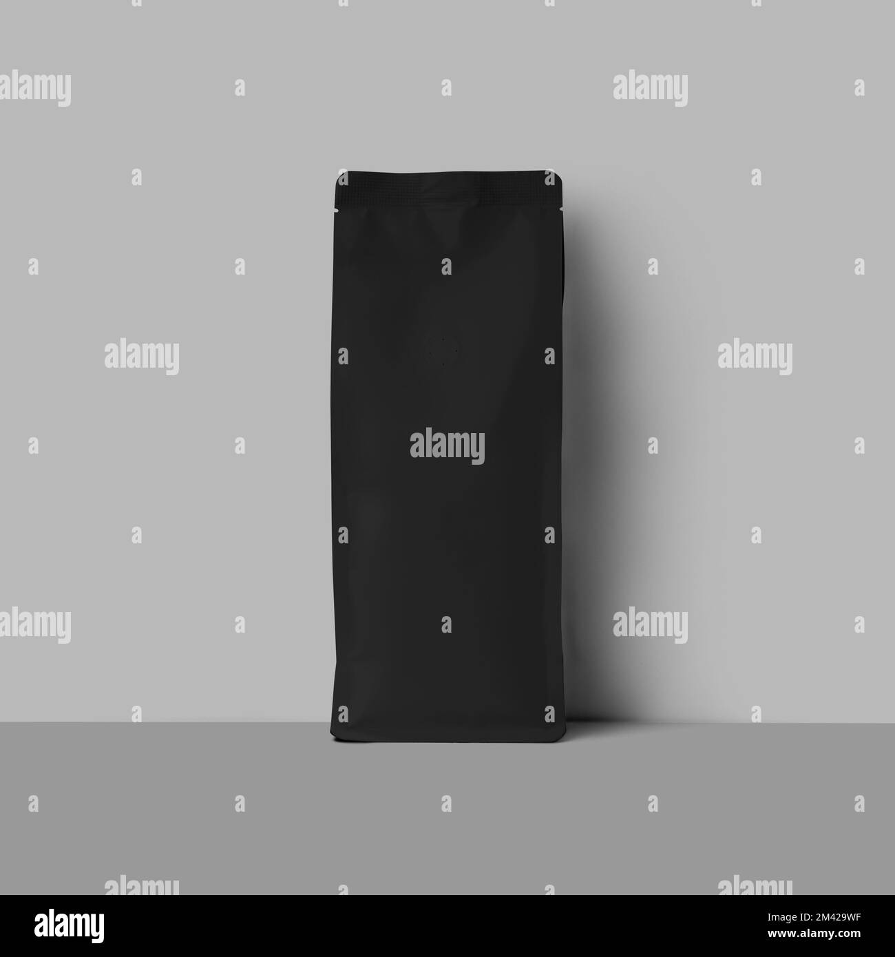 Mockup of a black coffee pouch, isolated on a wall background. Package ...