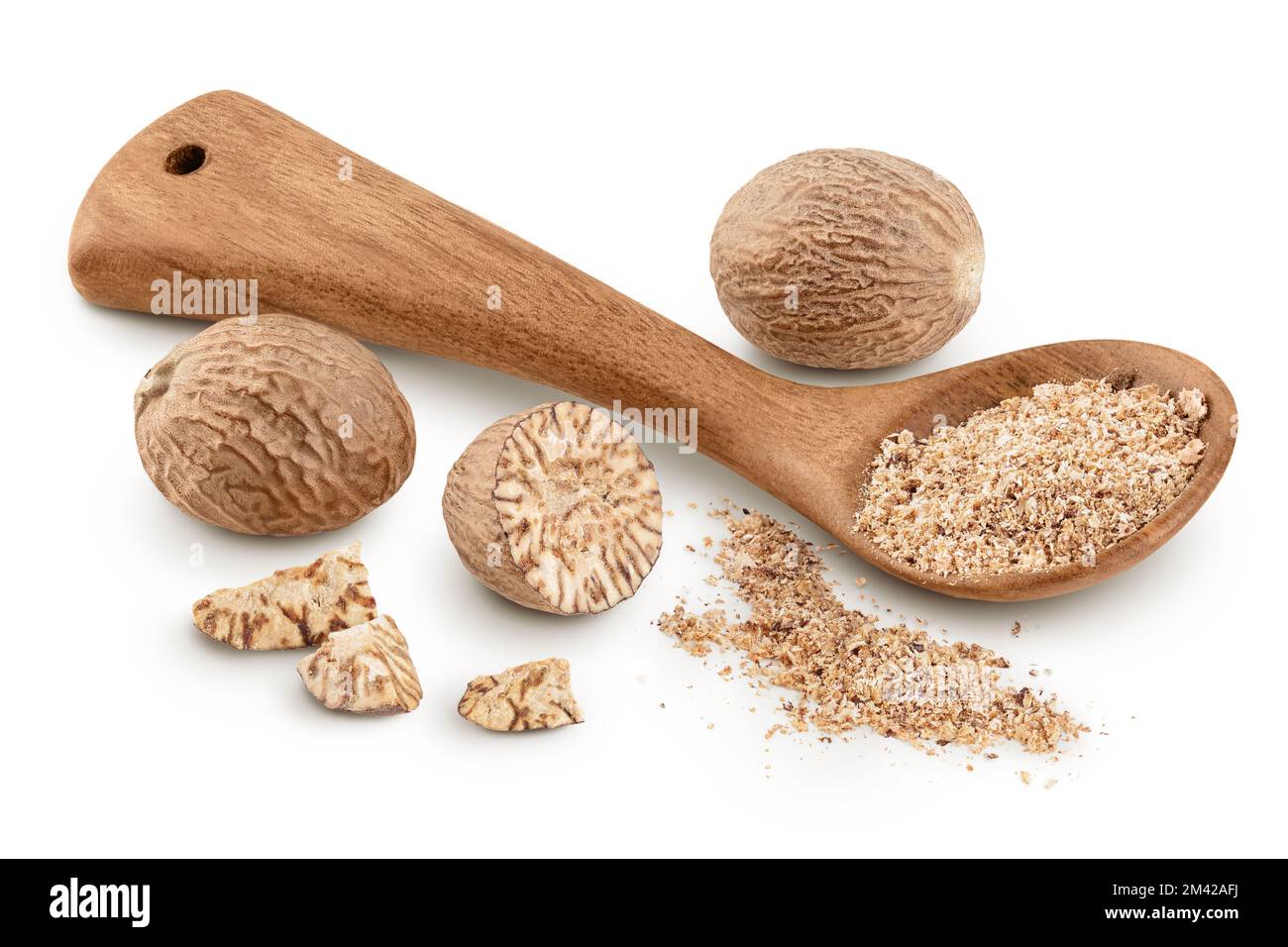 Whole and grated nutmeg in wooden spoon isolated on white background ...