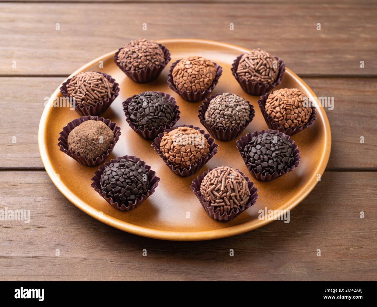 Typical brazilian brigadeiros, various flavors on a brown plate Stock ...