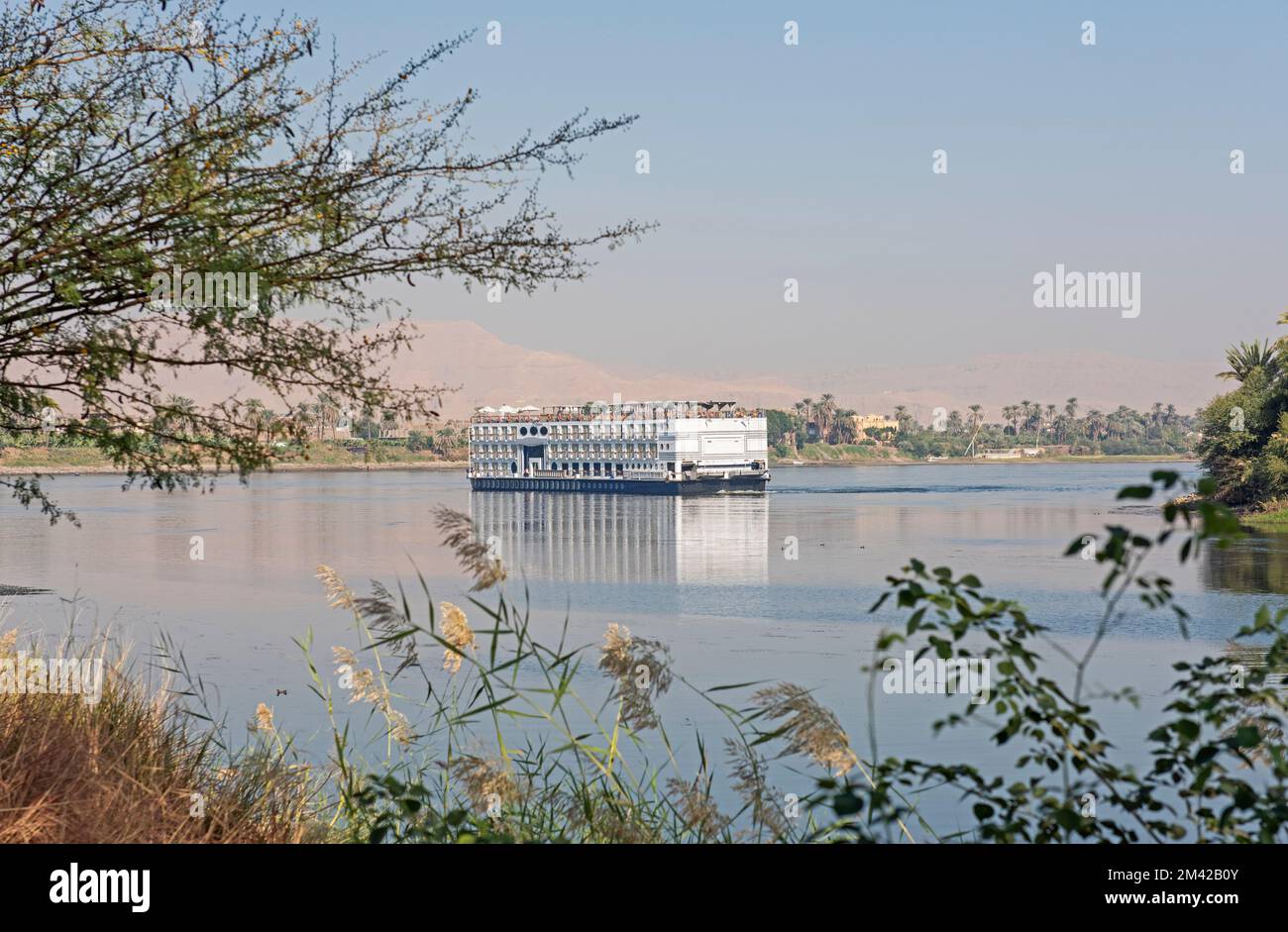 Large luxury traditional Egyptian river cruise boat sailing on the Nile ...