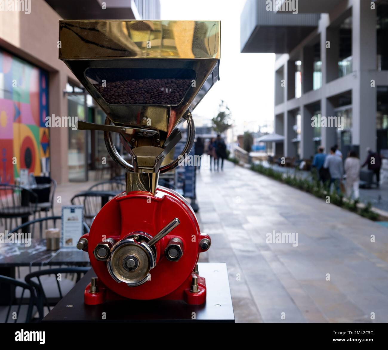 Coffee grinder on display in front of the store. Vintage coffee grinder ...