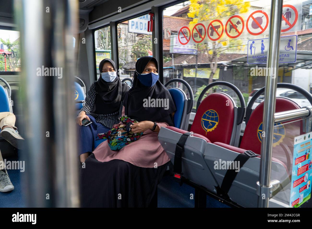 DENPASAR, AUG 24 2021: Two Muslim teenager tourists wearing headscarves ...