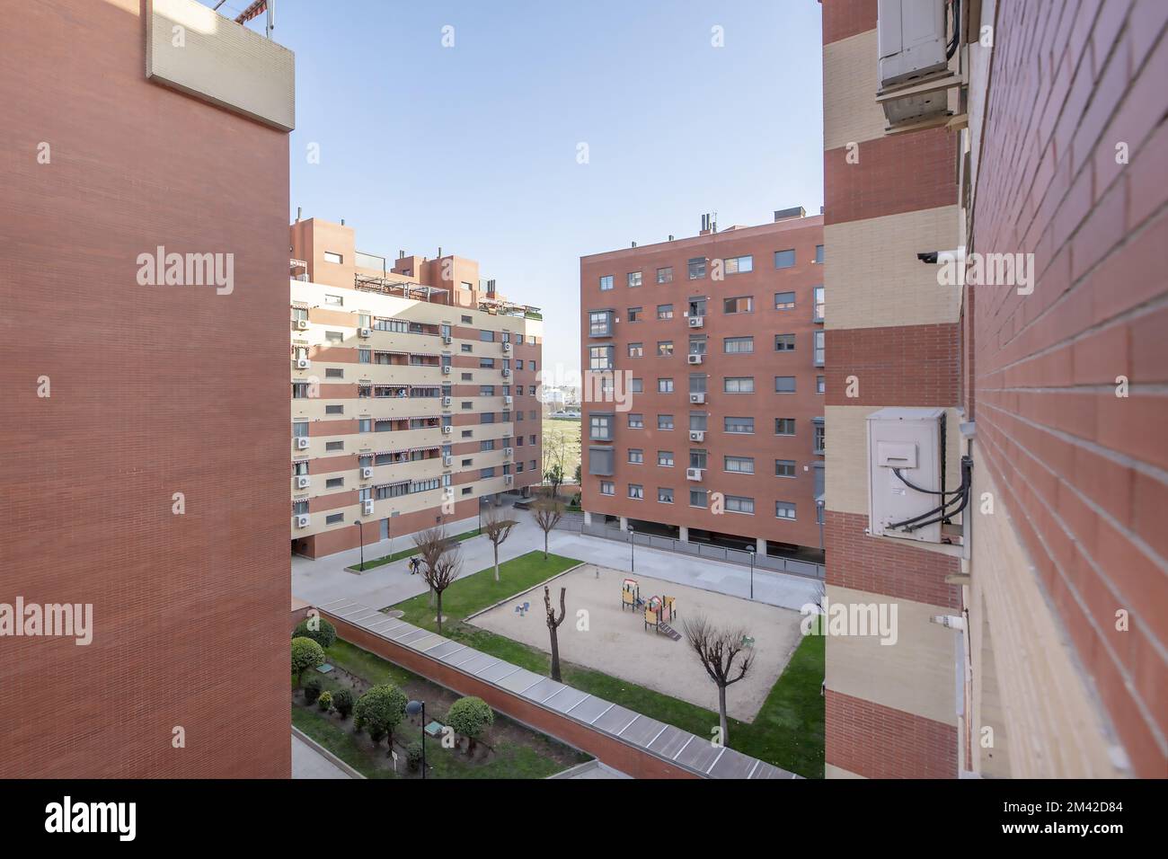 Common landscaped areas within a block patio of an urban residential ...