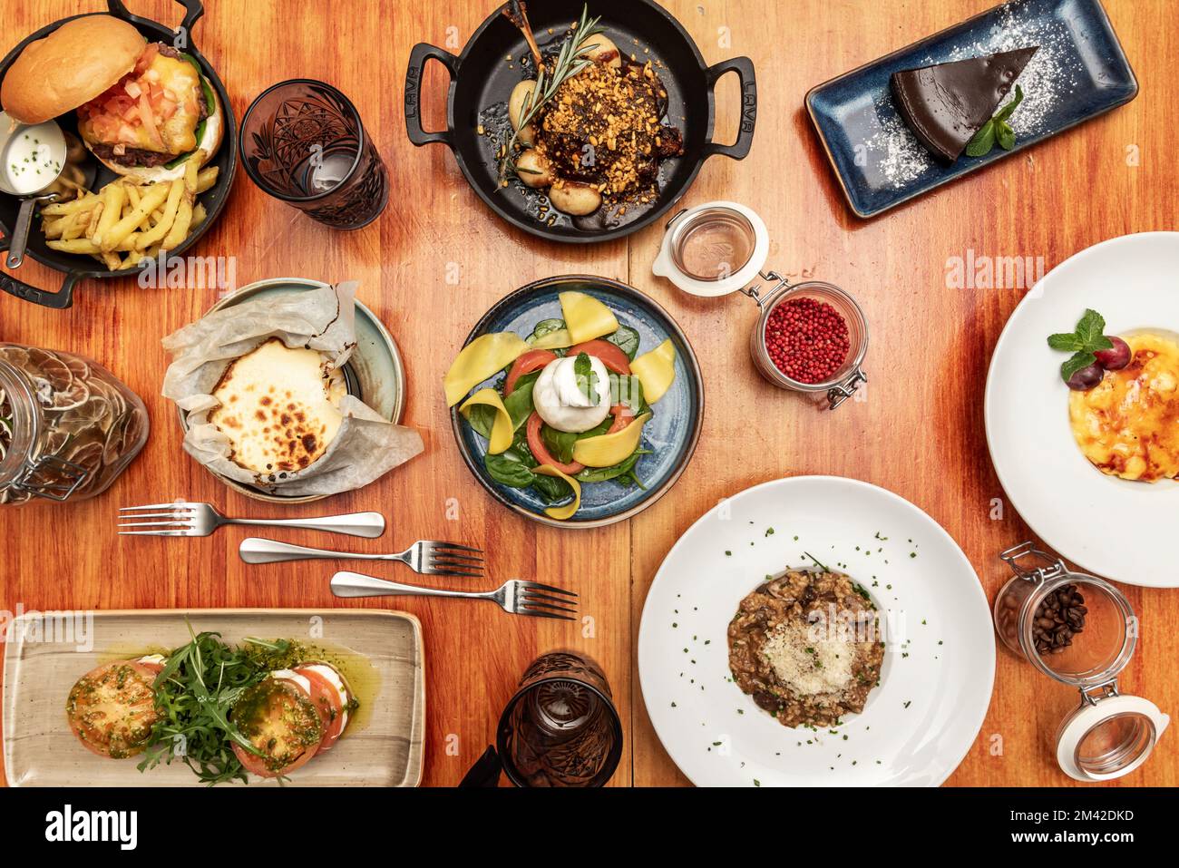 Still life of assorted dishes with braised beef with potatoes in a cast ...