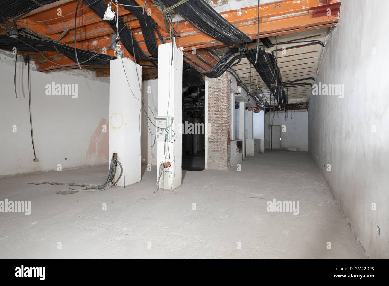 Site under construction with metal beams and corrugated plastic tubes ...