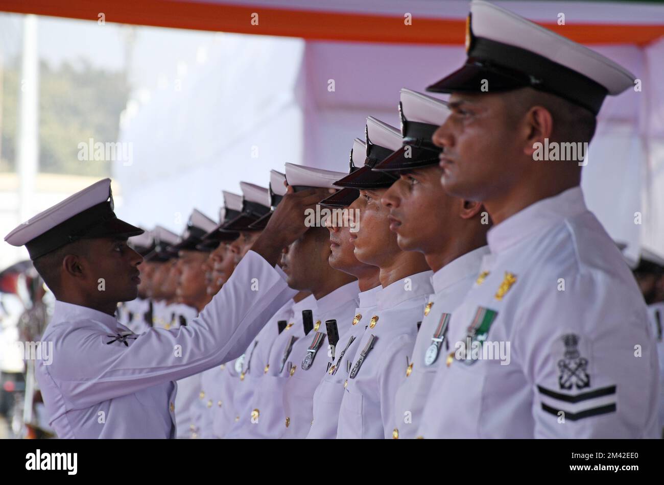 Mumbai, India. 18th Dec, 2022. A sailor adjusts a cap of a navy ...