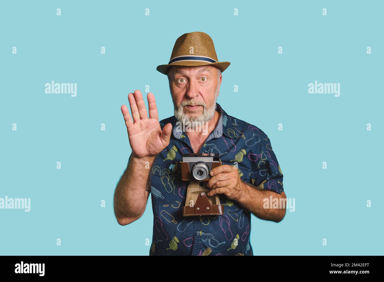 Strike a pose. Eldery man with gray beard and straw hat holding old ...