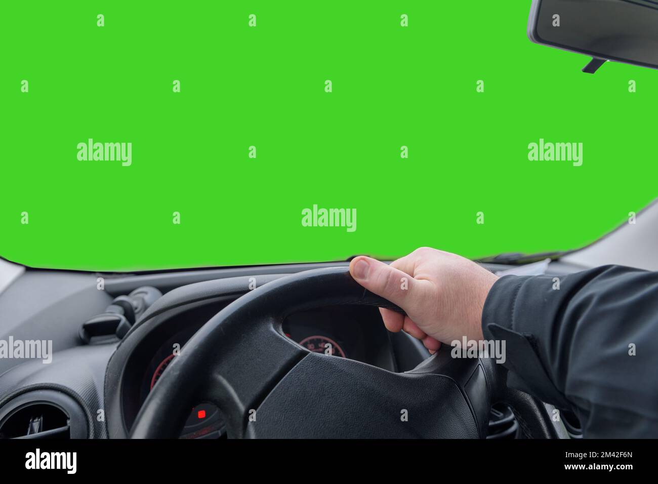 Hand on a car steering wheel. Maneuver on car, make a sharp left turn ...