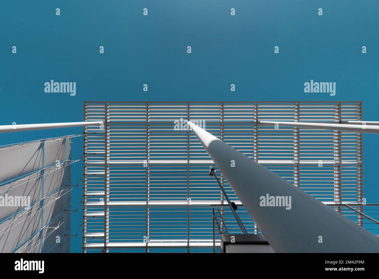 Architectural photography of a metal structure supported by long ...