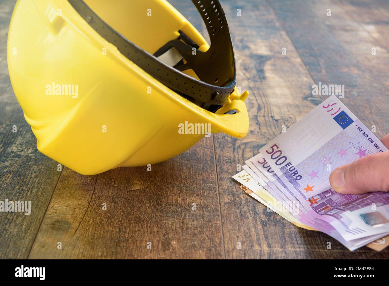 Construction budget investment. Euro money banknotes and yellow ...