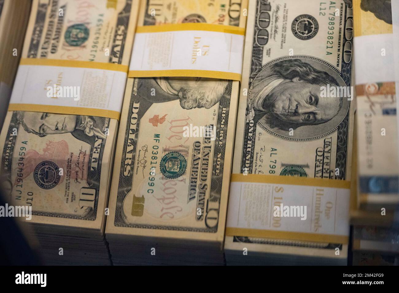 Tokyo, Japan. 16th Dec, 2022. Stacks of US Dollar bills featuring $10 ...