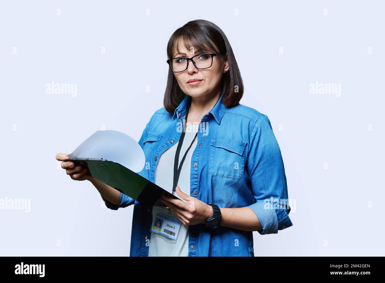 Portrait of woman worker with industrial center card clipboard, on ...