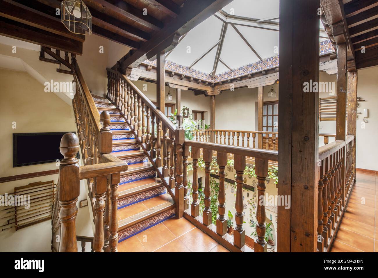 House of various heights with a wooden structure and stairs with ...