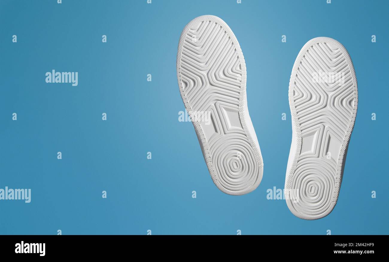 Two soles of sports shoe. White. Frontally on a blue background. Banner ...
