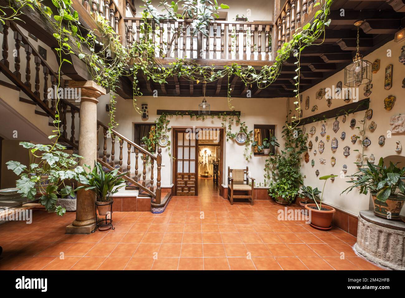 Interior patio of a house with various heights with wooden coffered ...