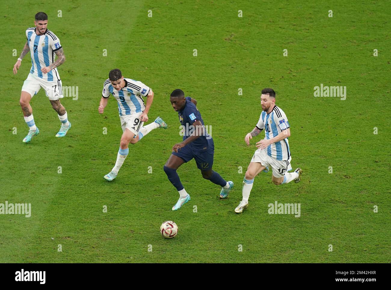Argentina's Lionel Messi (right) and France's Randal Kolo Muani battle ...