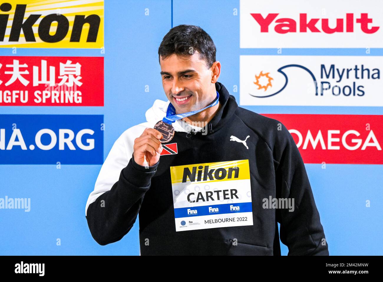 Melbourne, Australia. 17th Dec, 2022. Dylan Carter of Trinidad and Tobago shows the bronze medal ...