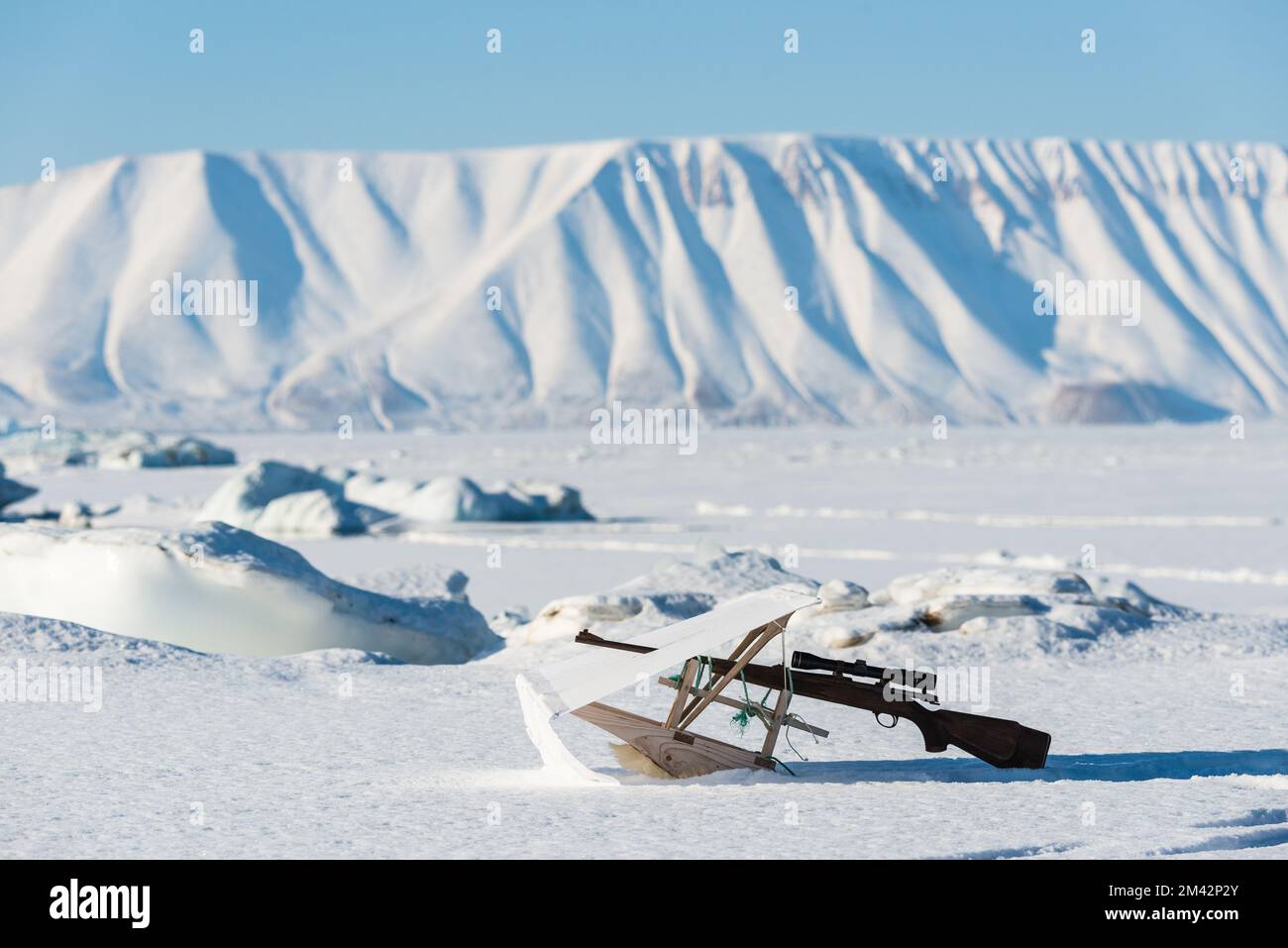 Inuit hunting rifle lying in snow Stock Photo - Alamy