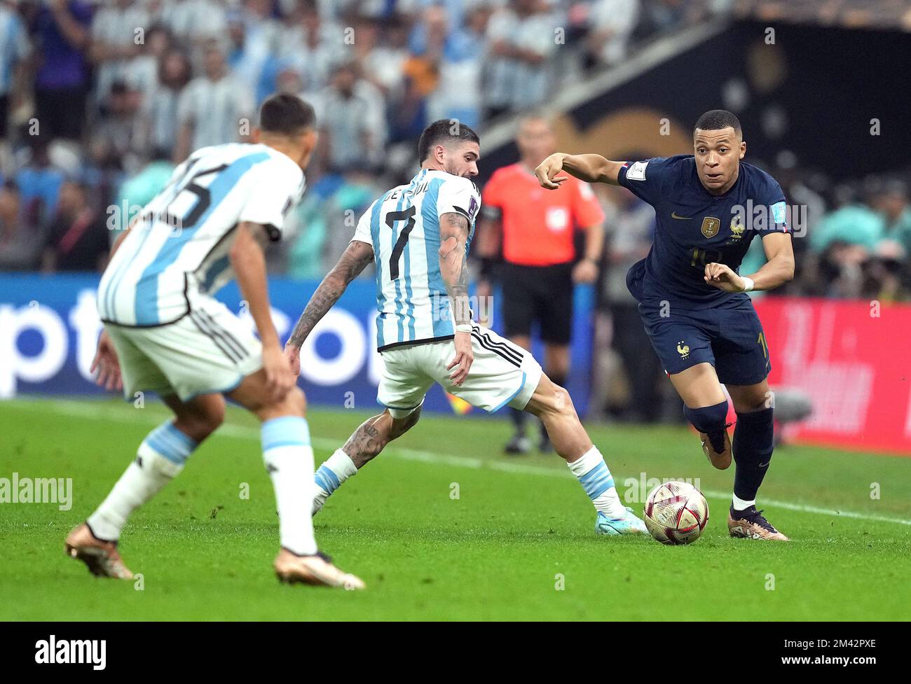 France's Kylian Mbappe (right) and Argentina's Rodrigo De Paul battle ...