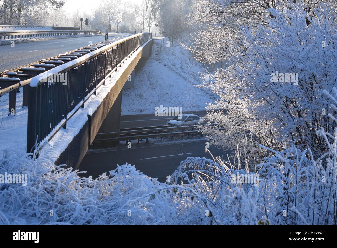 bridge across the Autobahn in winter with snow Stock Photo - Alamy