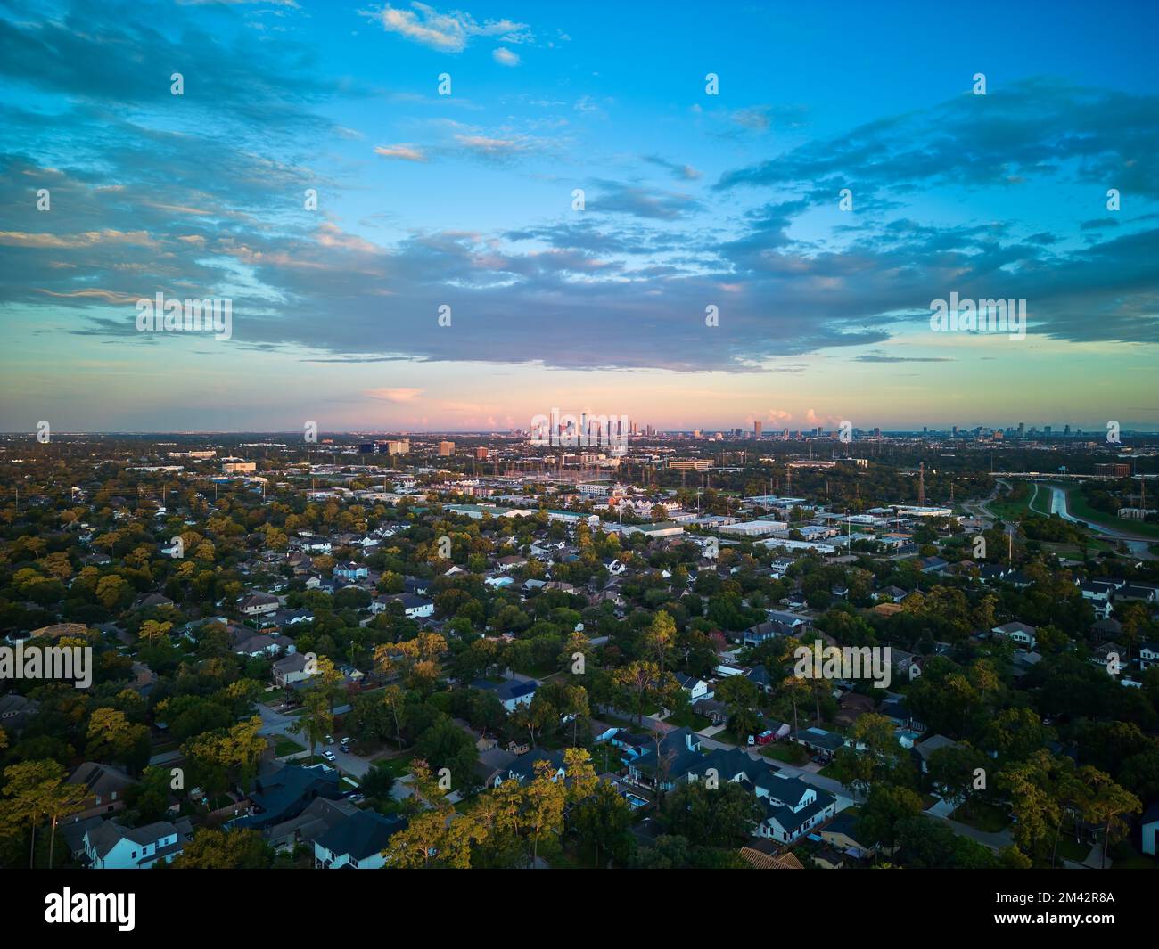 A horizontal aerial view of Houston, Texas skyline from a suburban ...