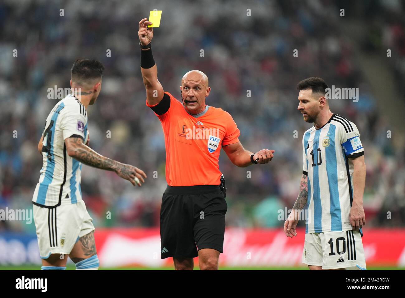 The referee shows yellow card to Enzo Fernandez of Argentina during the FIFA World Cup Qatar ...