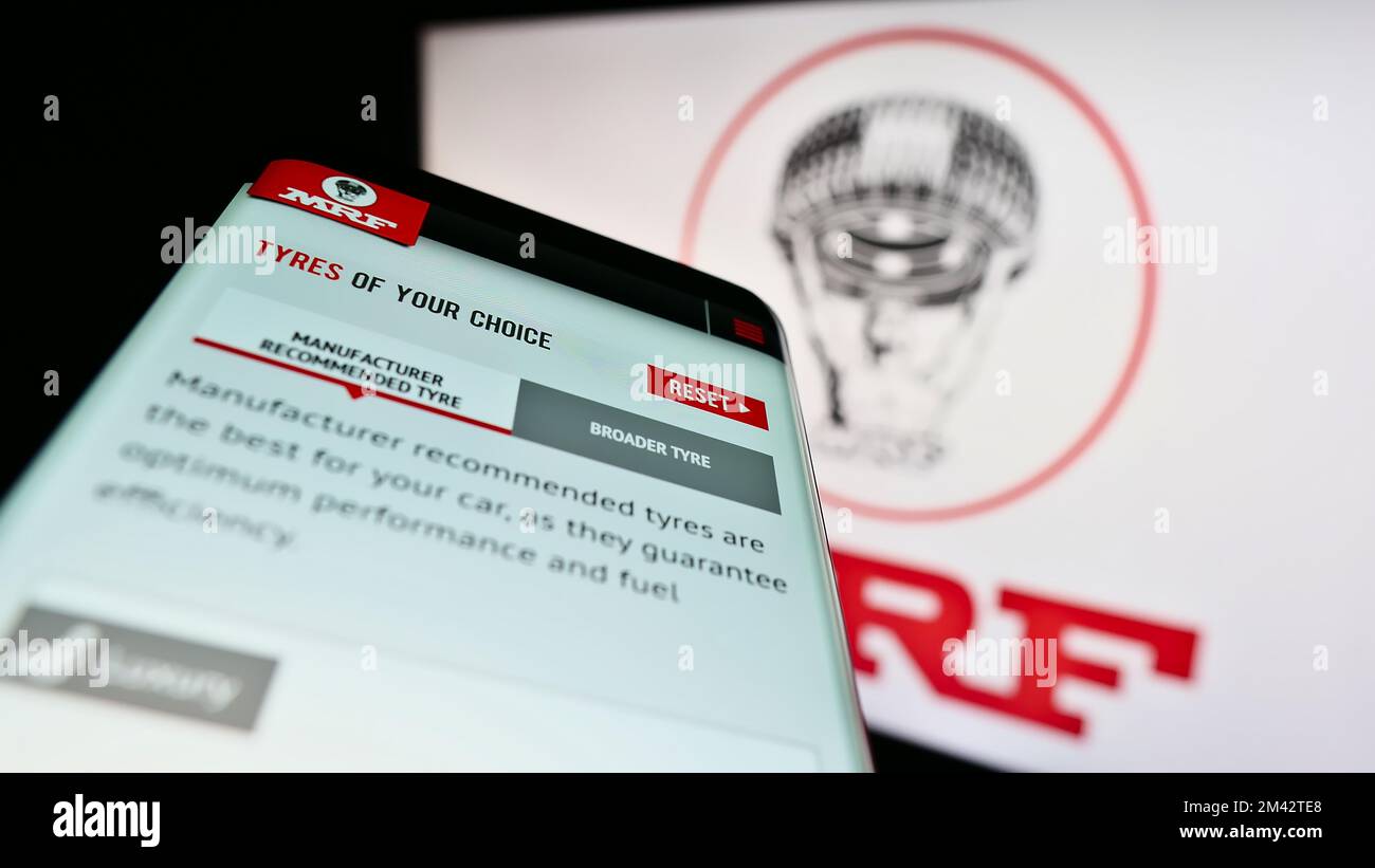 Mobile phone with webpage of Indian company Madras Rubber Factory (MRF ...