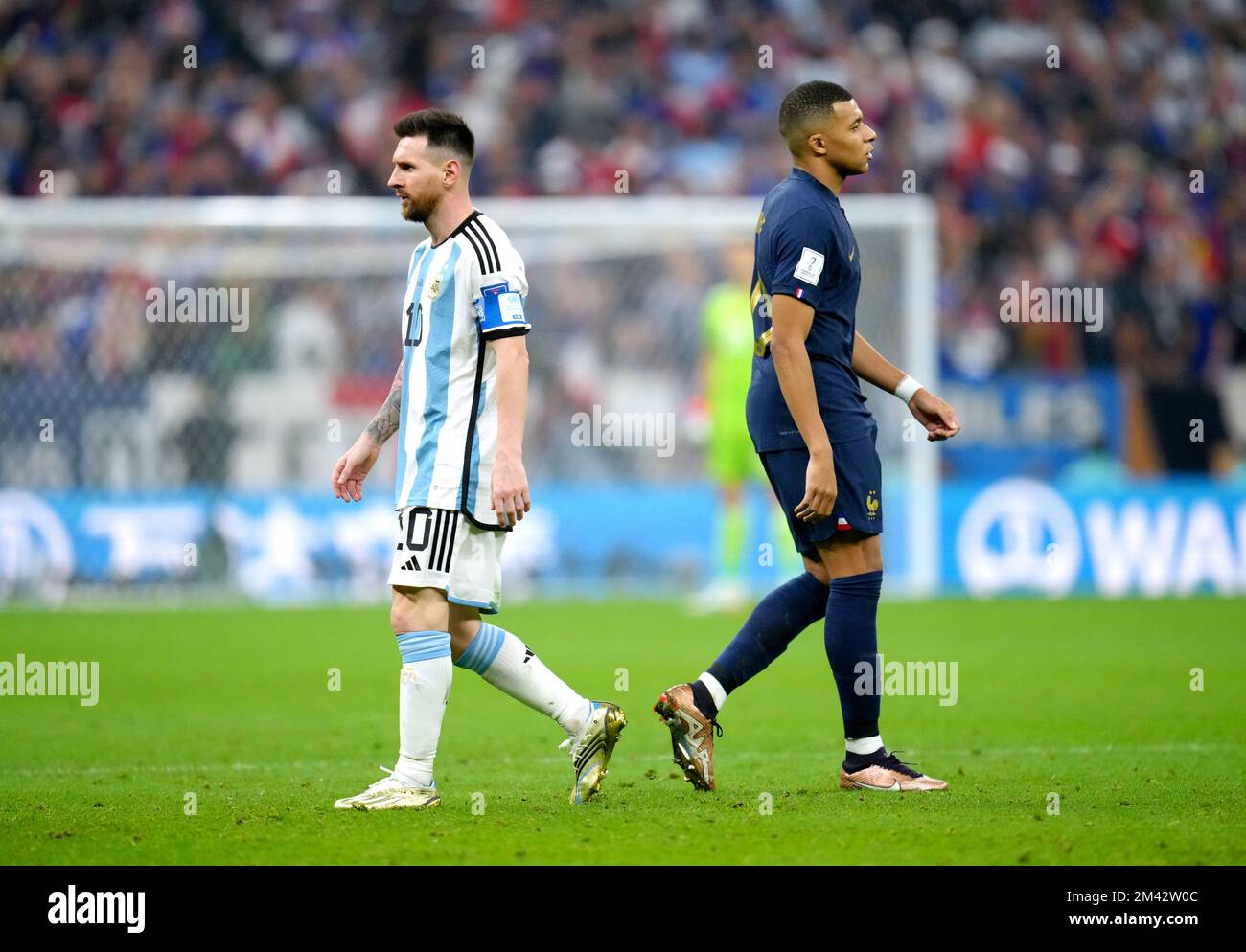 Argentina's Lionel Messi (left) and France's Kylian Mbappe walk past each other during the FIFA ...