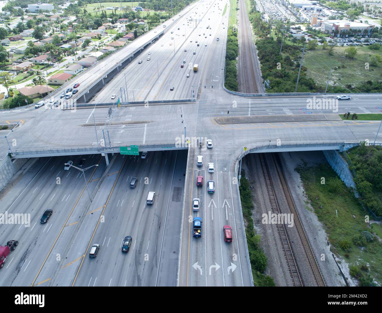 A beautiful view of an intersection with cars and railways Stock Photo ...